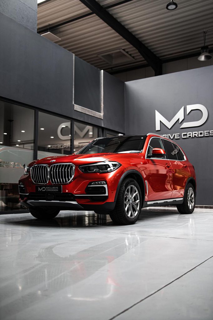 BMW X5 G05 - Folierung in PWF Ruby Red CC 4115 - M&D exclusive cardesign